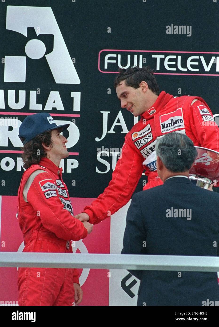 Ayrton Senna of Brazil, right, shakes hands with his teammate, Alain ...
