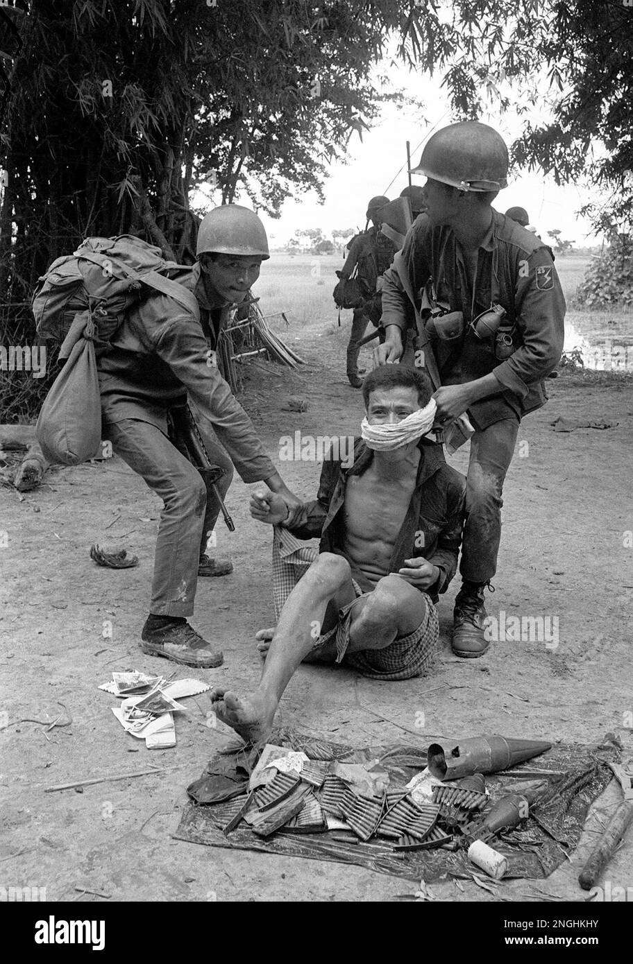 South Vietnamese Arvn Soldiers Restrain A Khmer Rouge Suspect Captured