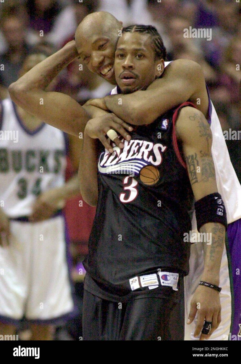 Philadelphia 76ers' Allen Iverson is huugged by Milwaukee Bucks' Sam ...