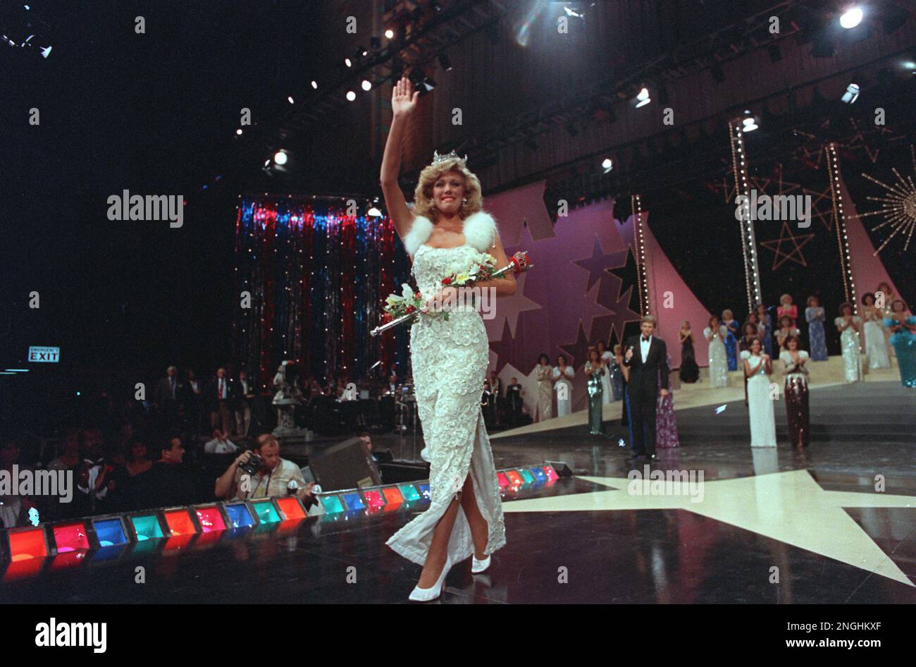 Susan Akin, of Meridian, Miss., waves to the crowd as she walks down ...