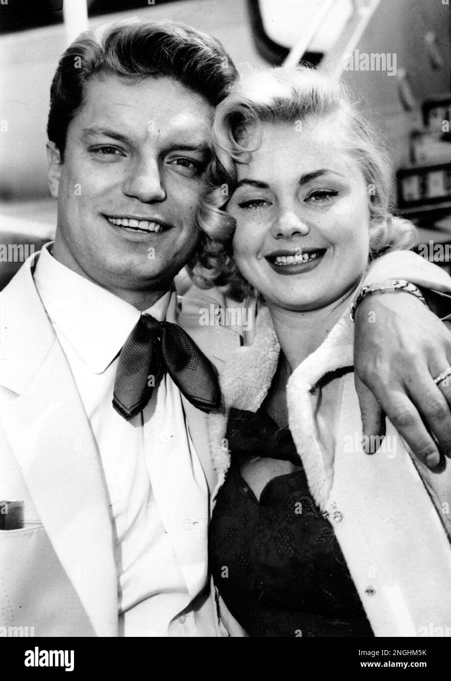 American singer Guy Mitchell and his Danish wife, Else, 22, pose after their arrival from New ...