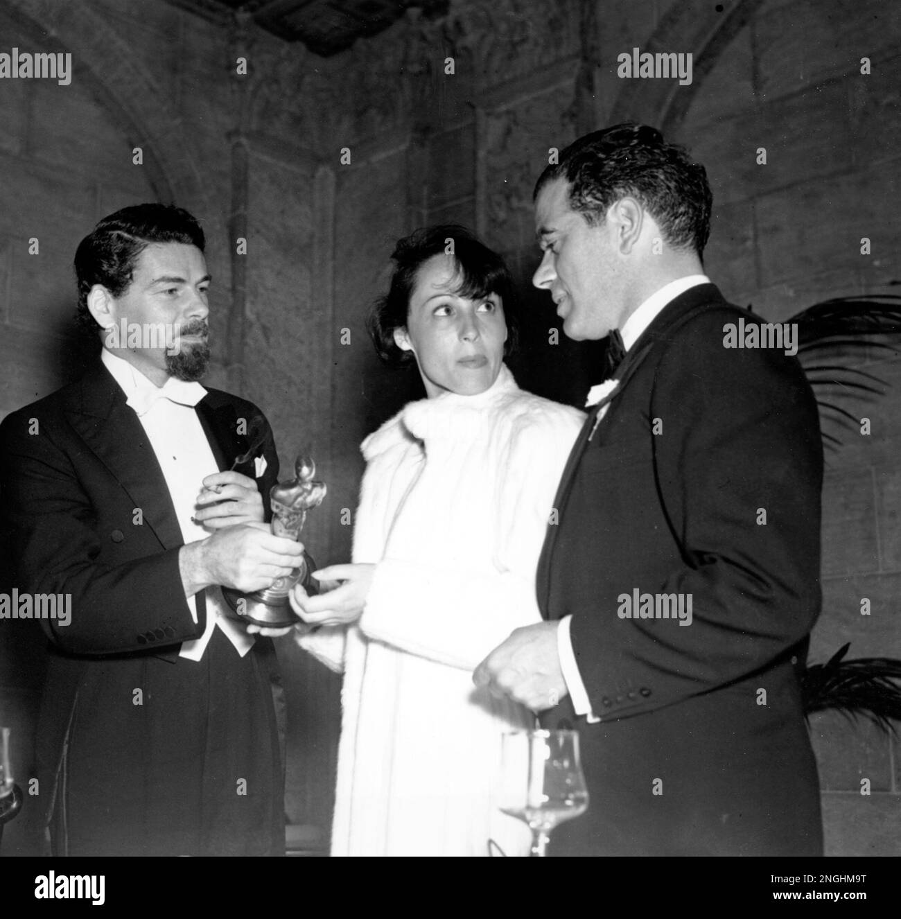 Oscar winners Paul Muni, holding statuette, Louise Rainer, center, and ...