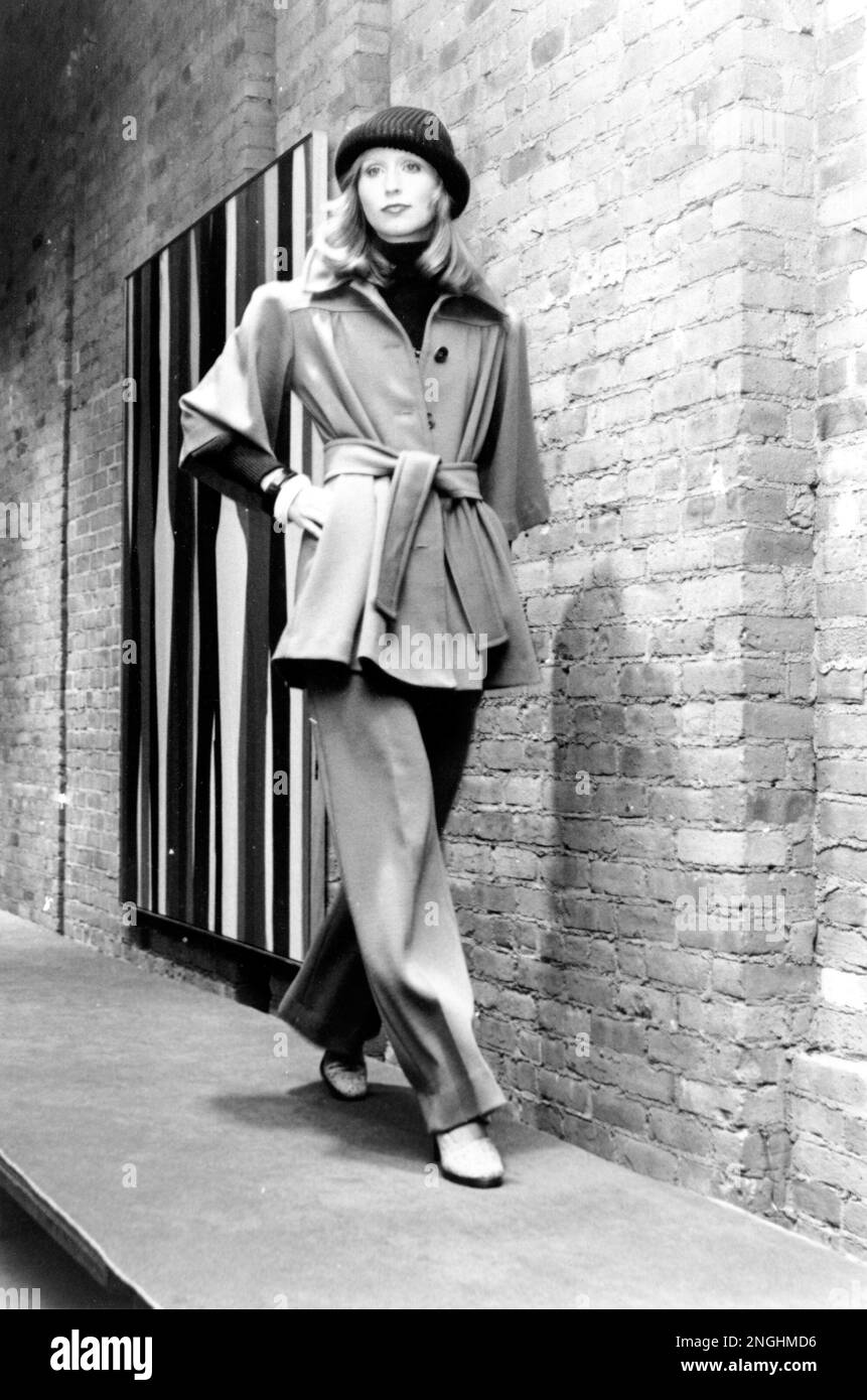 A jacket with extended shoulders and matching pants by Scott Barrie are ...