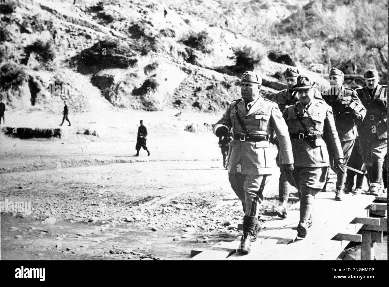 Italian dictator Benito Mussolini walks on an inspection tour of the ...