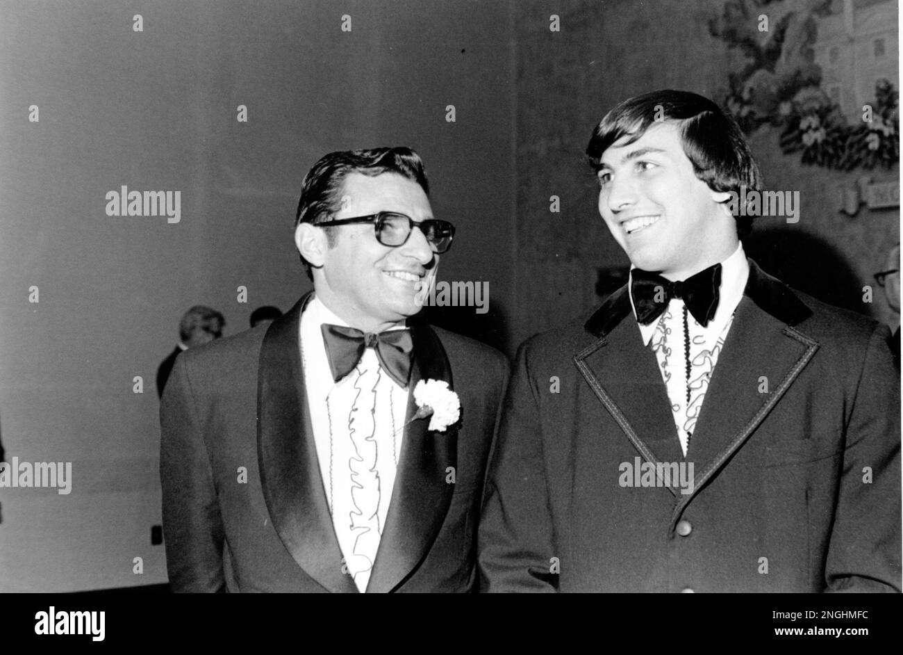Penn State football coach Joe Paterno, left, poses with John ...