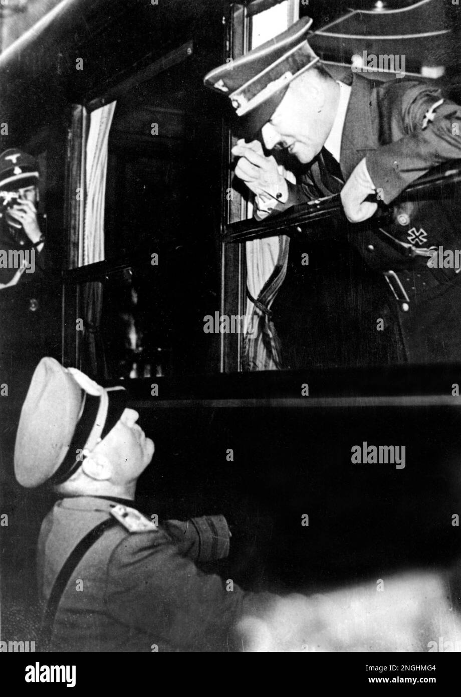 German Chancellor Adolf Hitler, leaning out of a train window ...