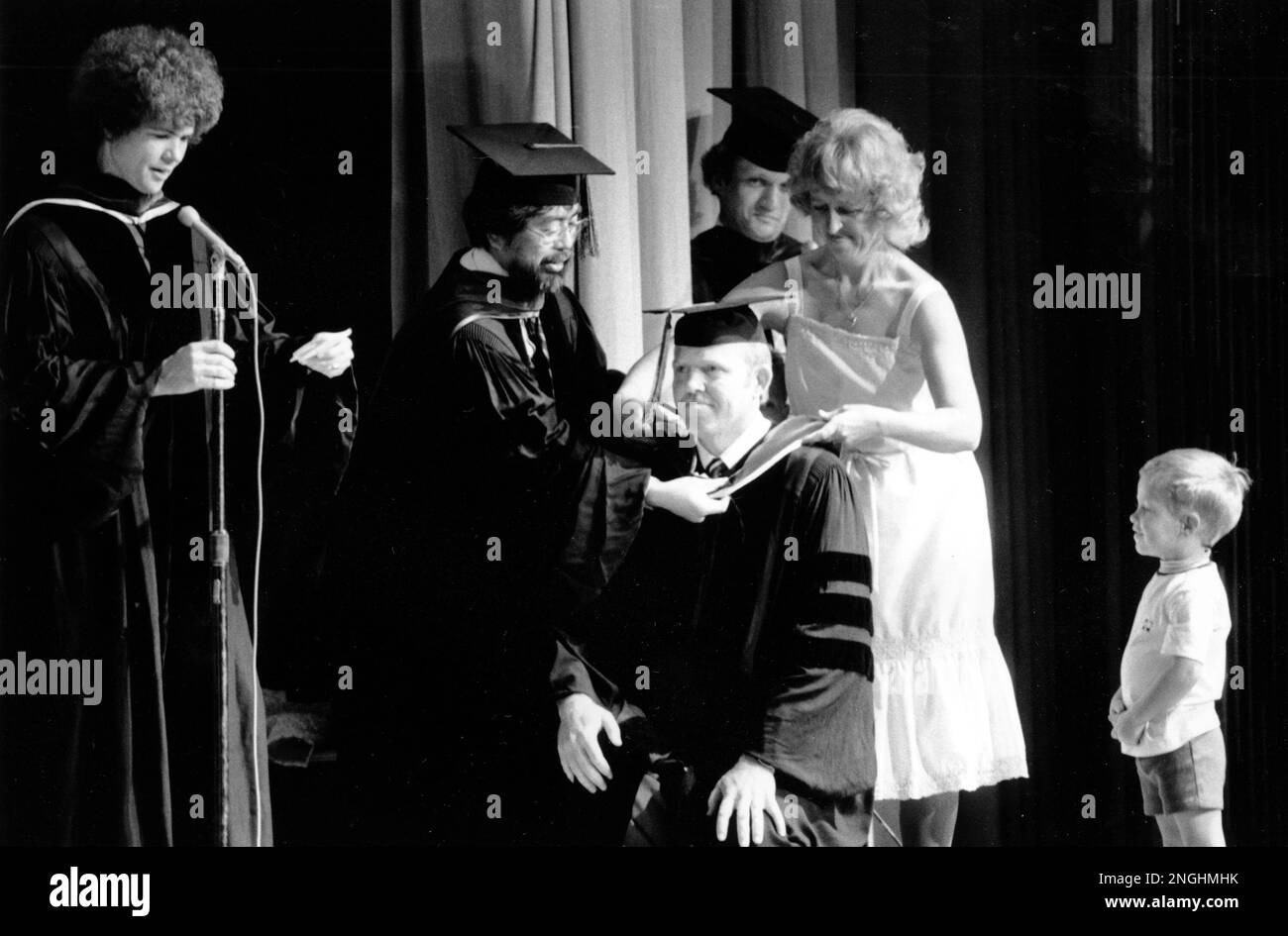 Allan Bakke is hooded by his wife before receiving his degree in ...