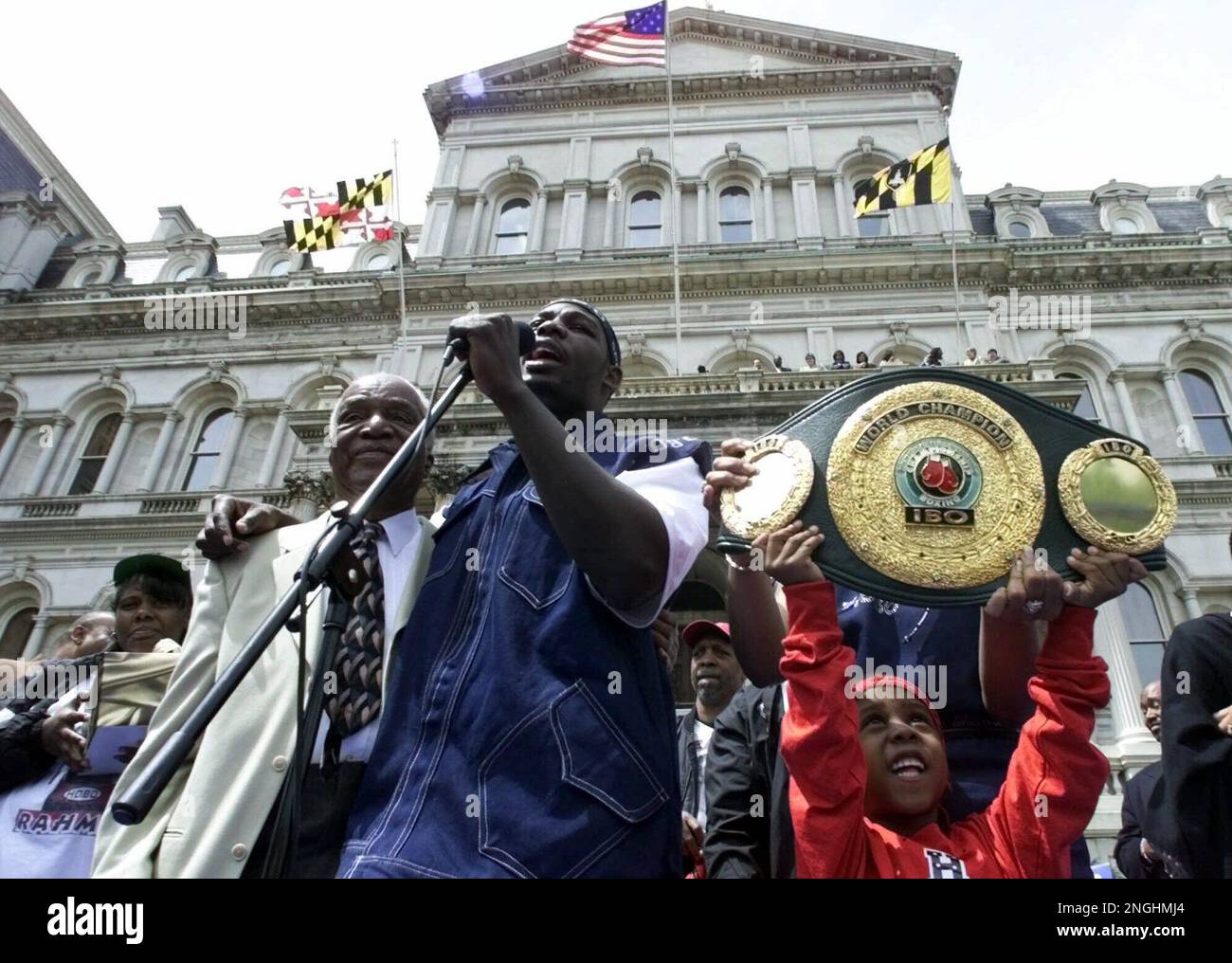 Heavyweight champion Hasim Rahman embraces Mack Lewis, his first ...