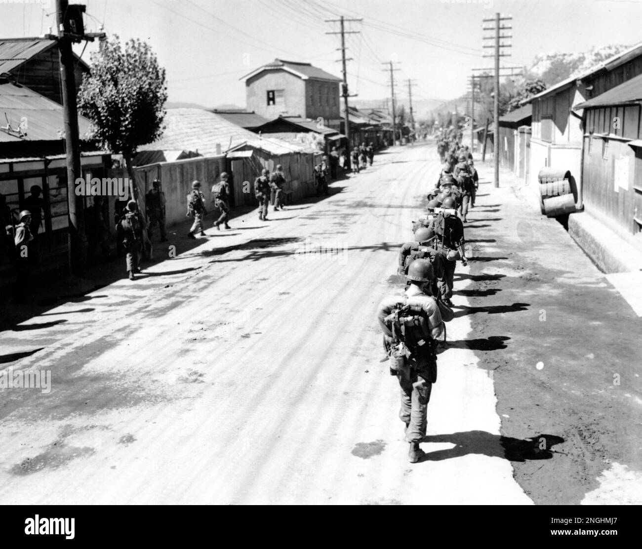 Troops of the U.S. First Cavalry Division march in a single line on ...