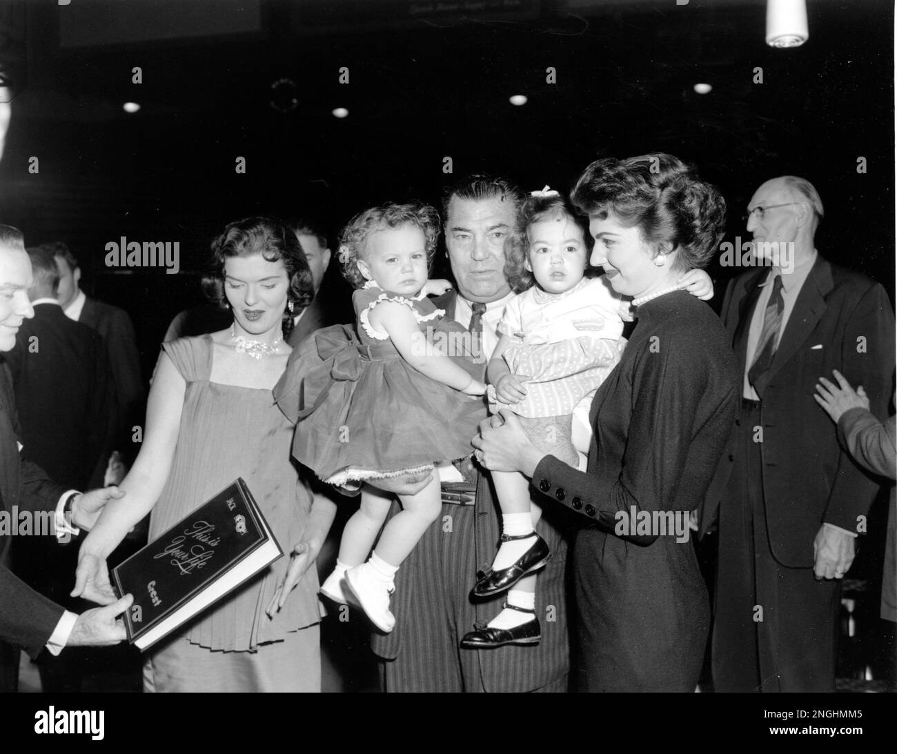 Jack Dempsey is shown with his family on "This Is Your Life" TV show at ...