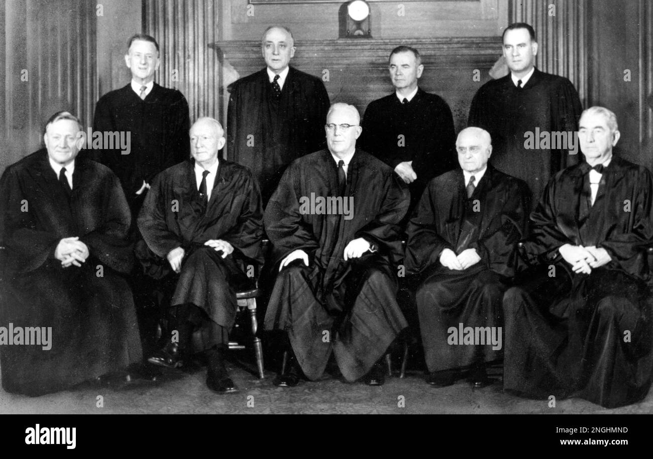 Justices of the U.S. Supreme Court pose for a portrait in their robes ...