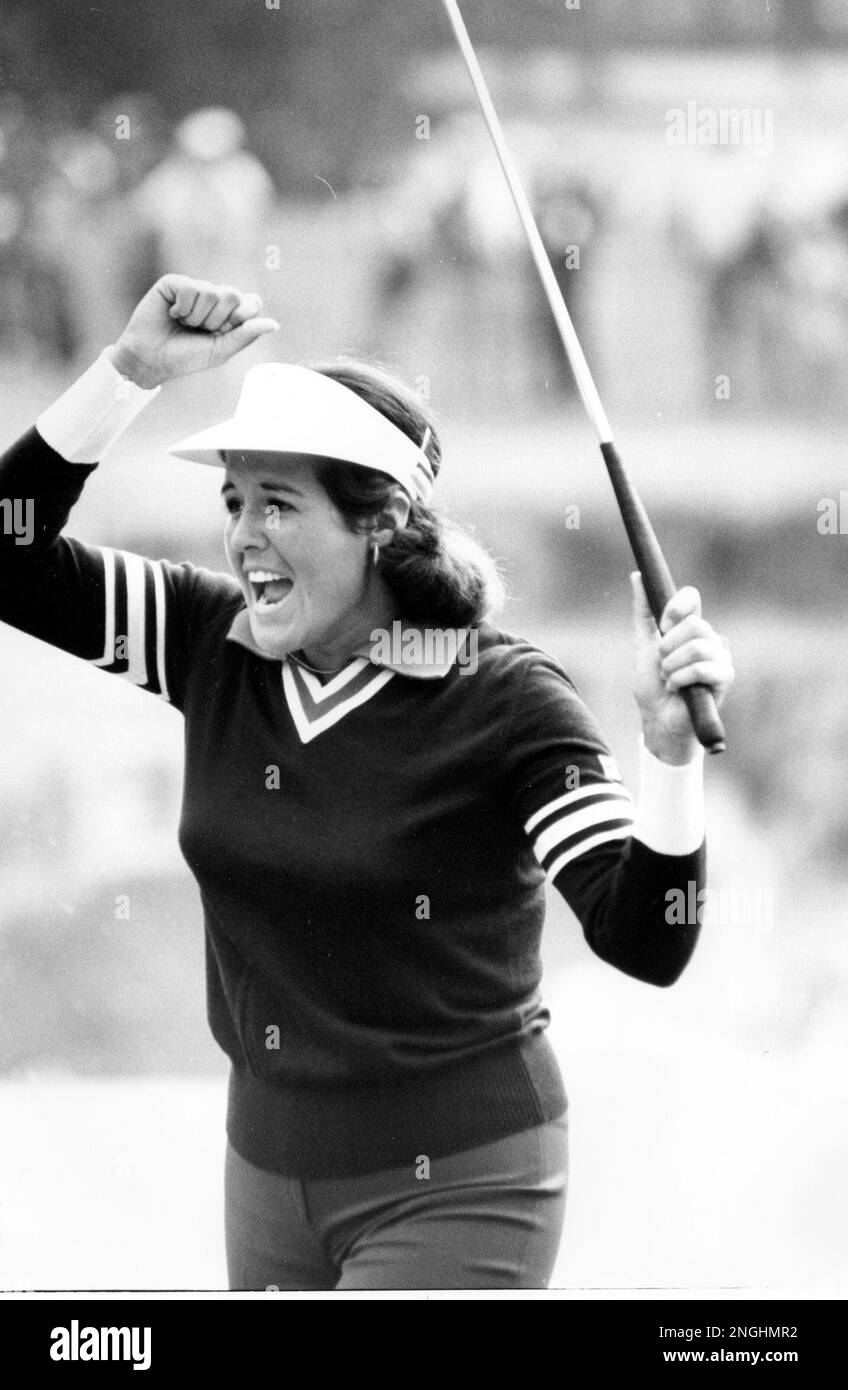 Nancy Lopez raises her arms in victory after she sank a 10-foot birdie ...