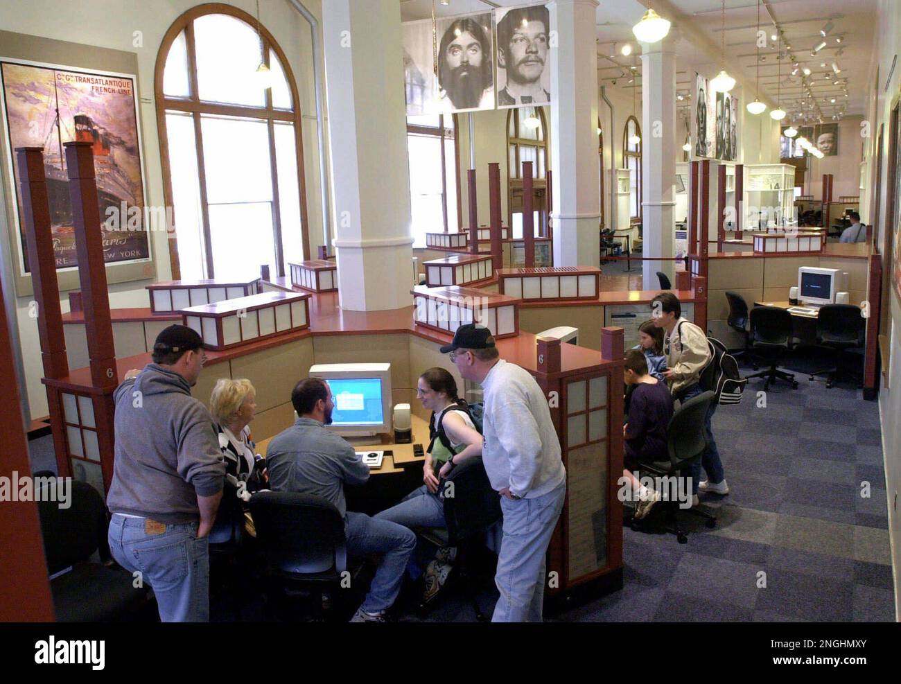 Visitors to Ellis Island in New York check out the new American Family ...