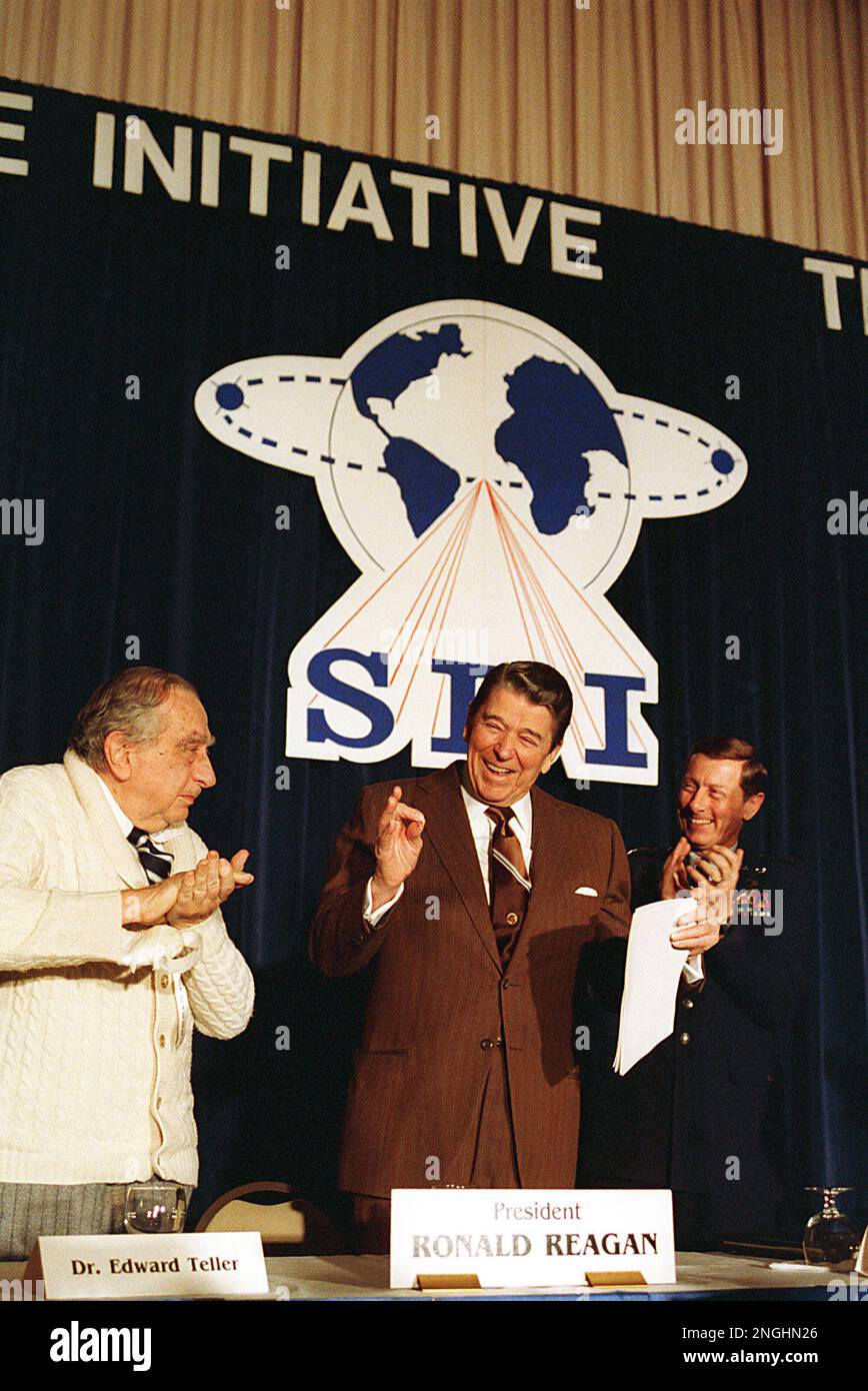 U.S. President Ronald Reagan is flanked by physicist Dr. Edward Teller ...