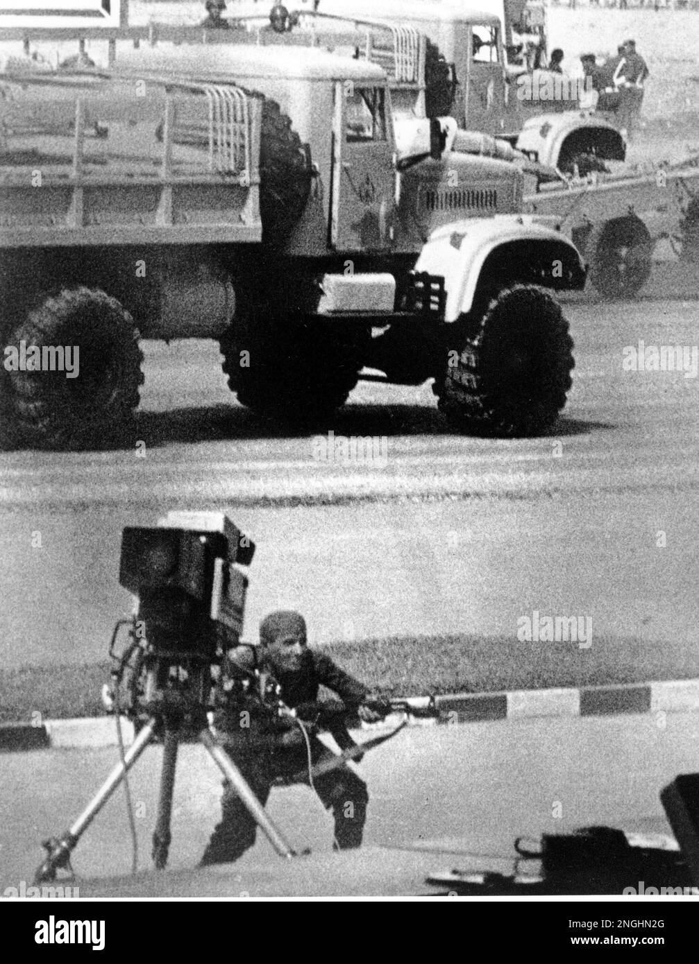 A gunman, wearing an Egyptian army uniform, fires an automatic ...