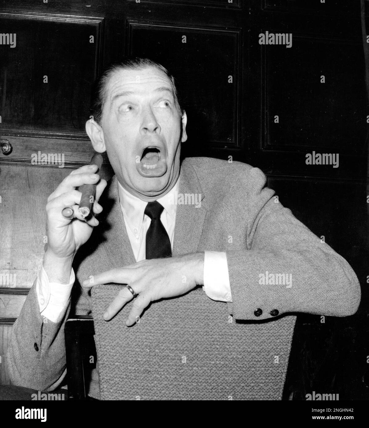 Actor-comedian Milton Berle, with cigar in hand, hams it up for the ...