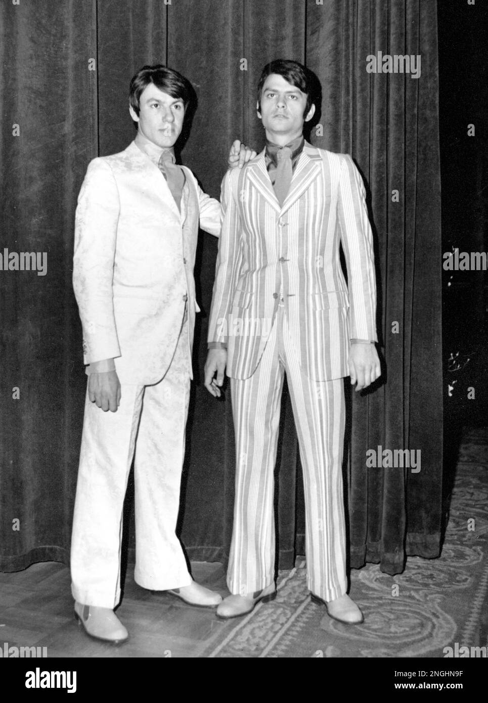 A white silk damask suit, left, and a brown and white striped linen ...