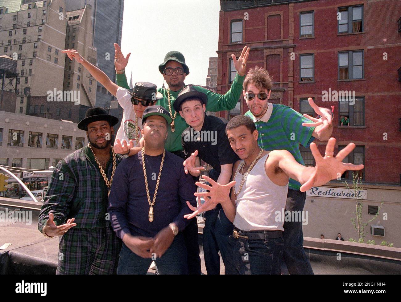 The street music groups Run-DMC and the Beastie Boys pose atop a ...