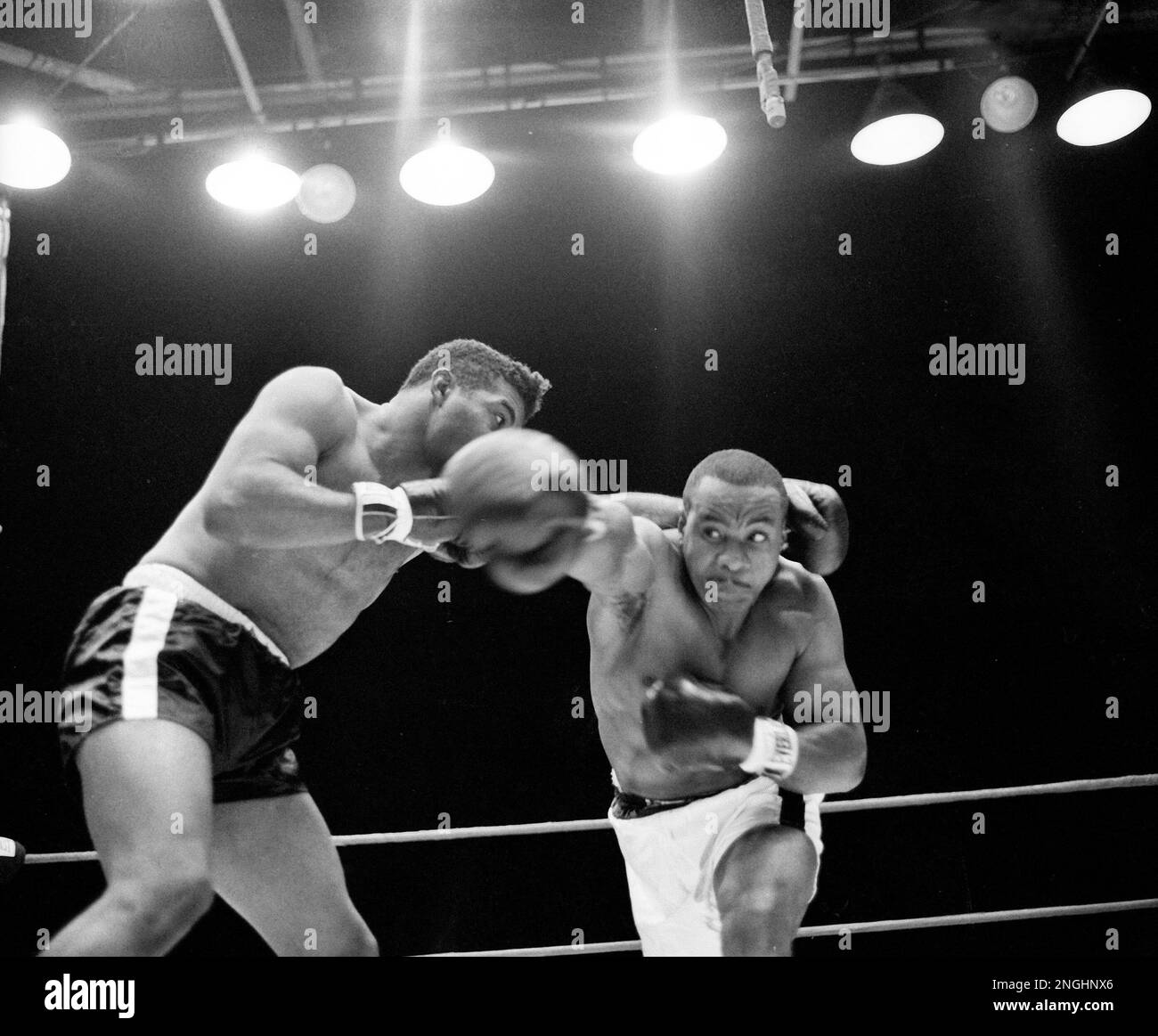 Floyd Patterson receives a left hook from challenger Sonny Liston that ...