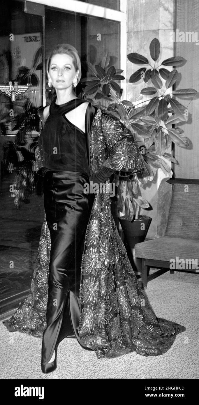 Model Roalle Calvert wears Don Loper's sequined evening coat over a ...