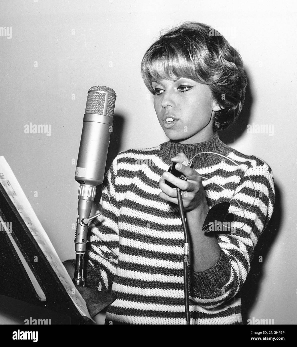 Nancy Sinatra, 20-year-old daughter of Frank Sinatra Sr., sings "Sugar ...