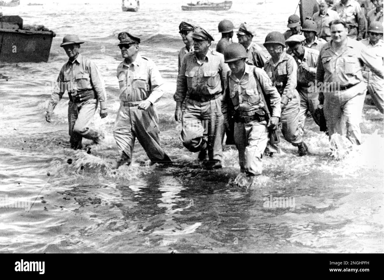 Gen. Douglas MacArthur, second from left, is accompanied by his ...
