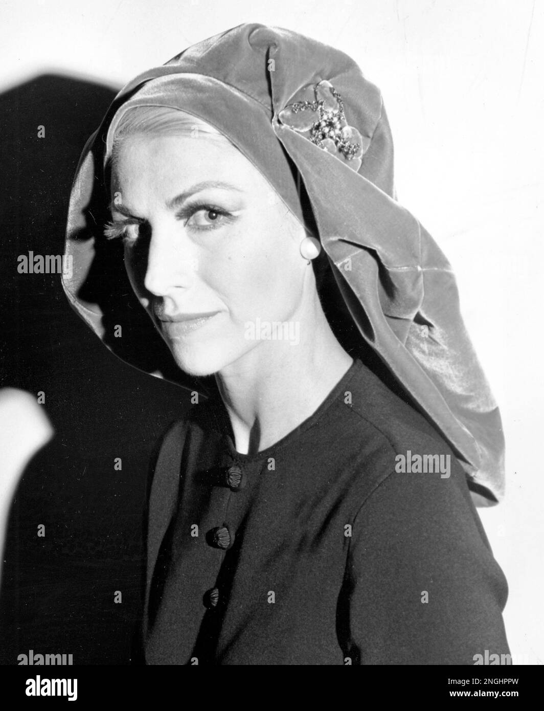 A head-molding brown velvet turban under an LBJ rolled brim is among ...