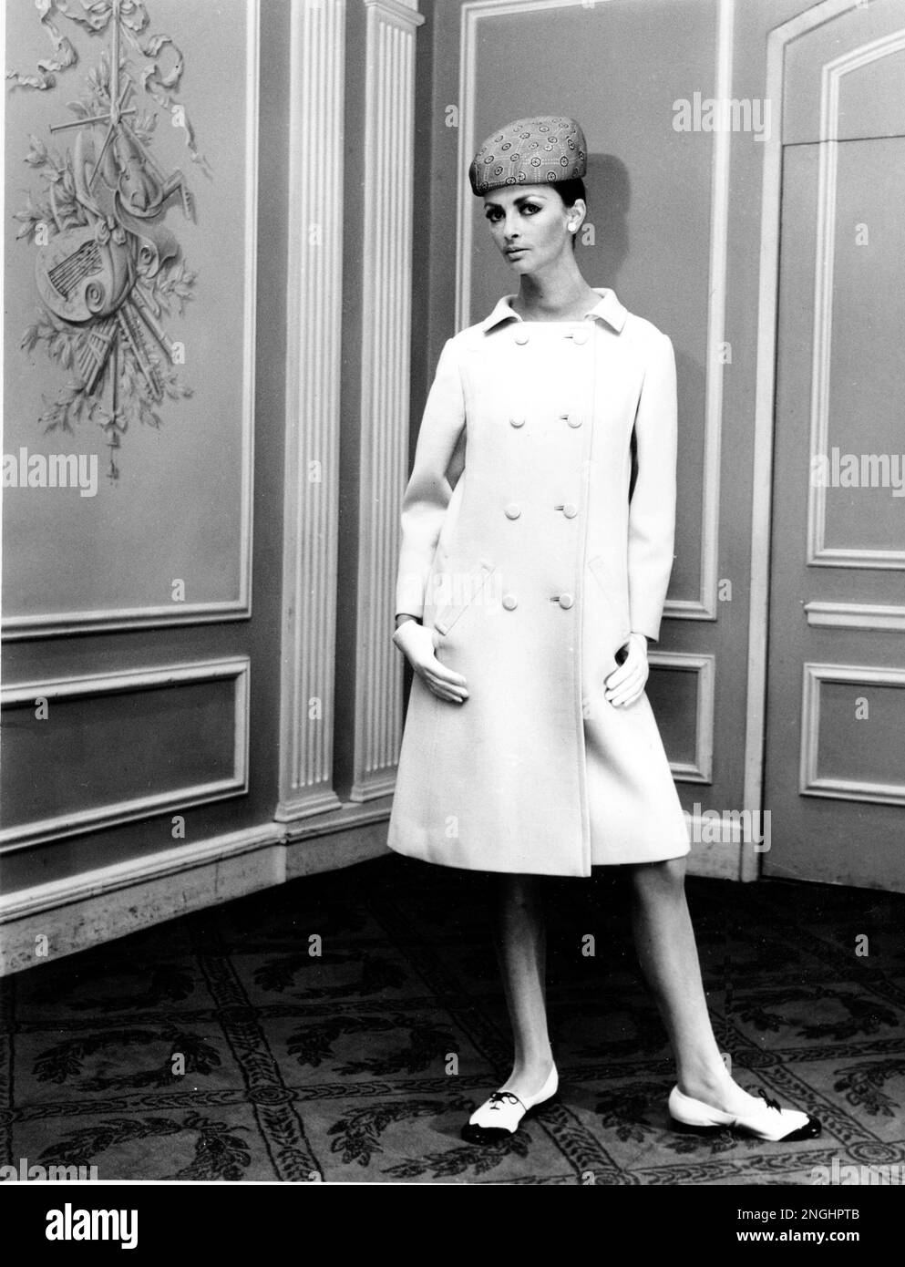 A model poses in a pink sheer wool spring coat by Originala in New York ...