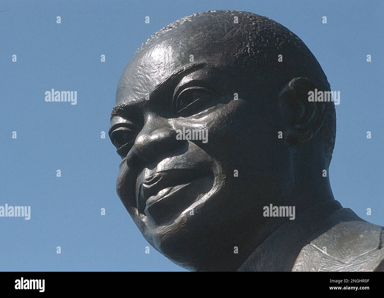 A close-up of Louis Armstrong's sculptured face is seen against the ...