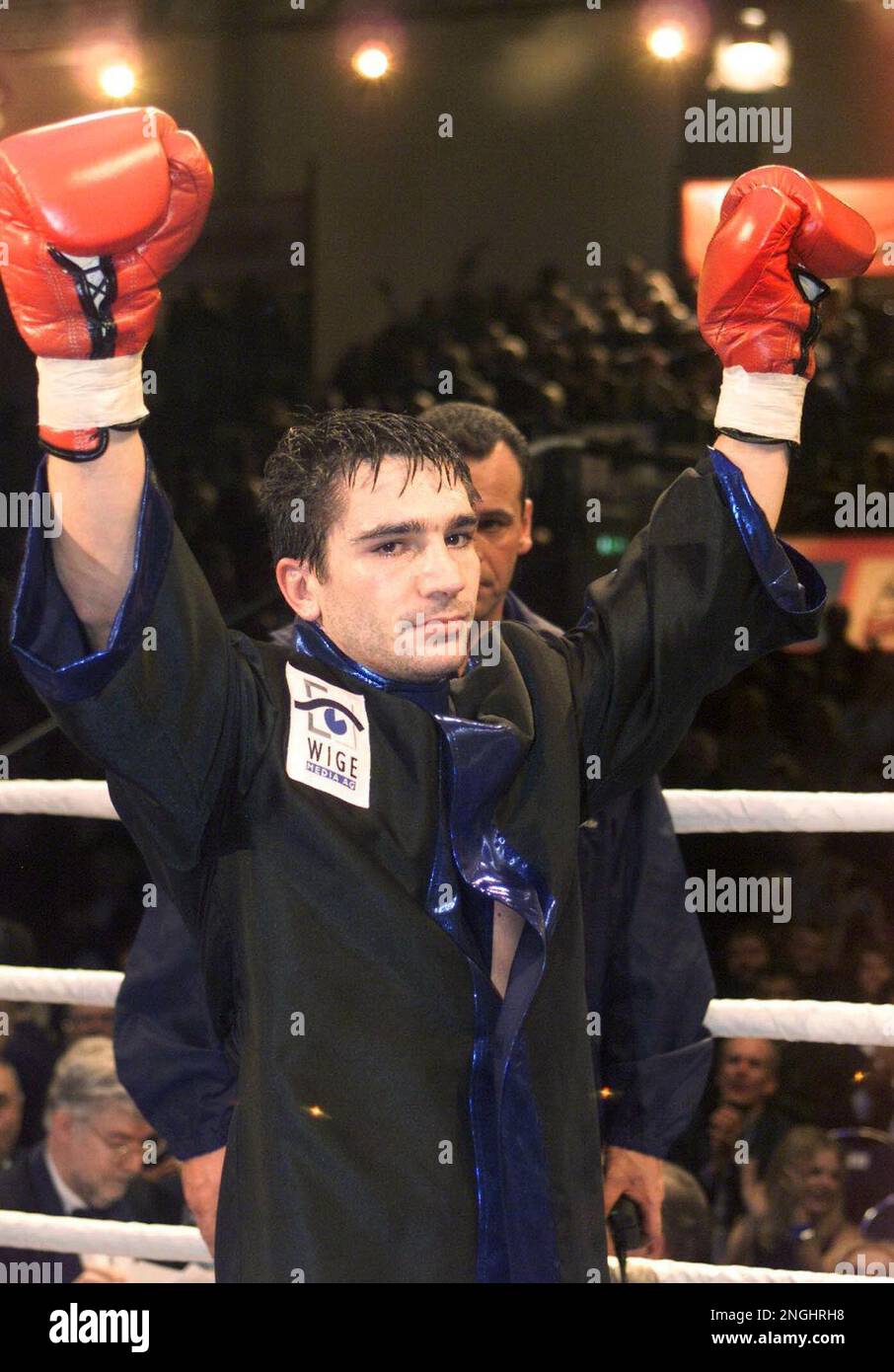 Germany's boxer Markus Beyer races his arms while jubilating as winner ...