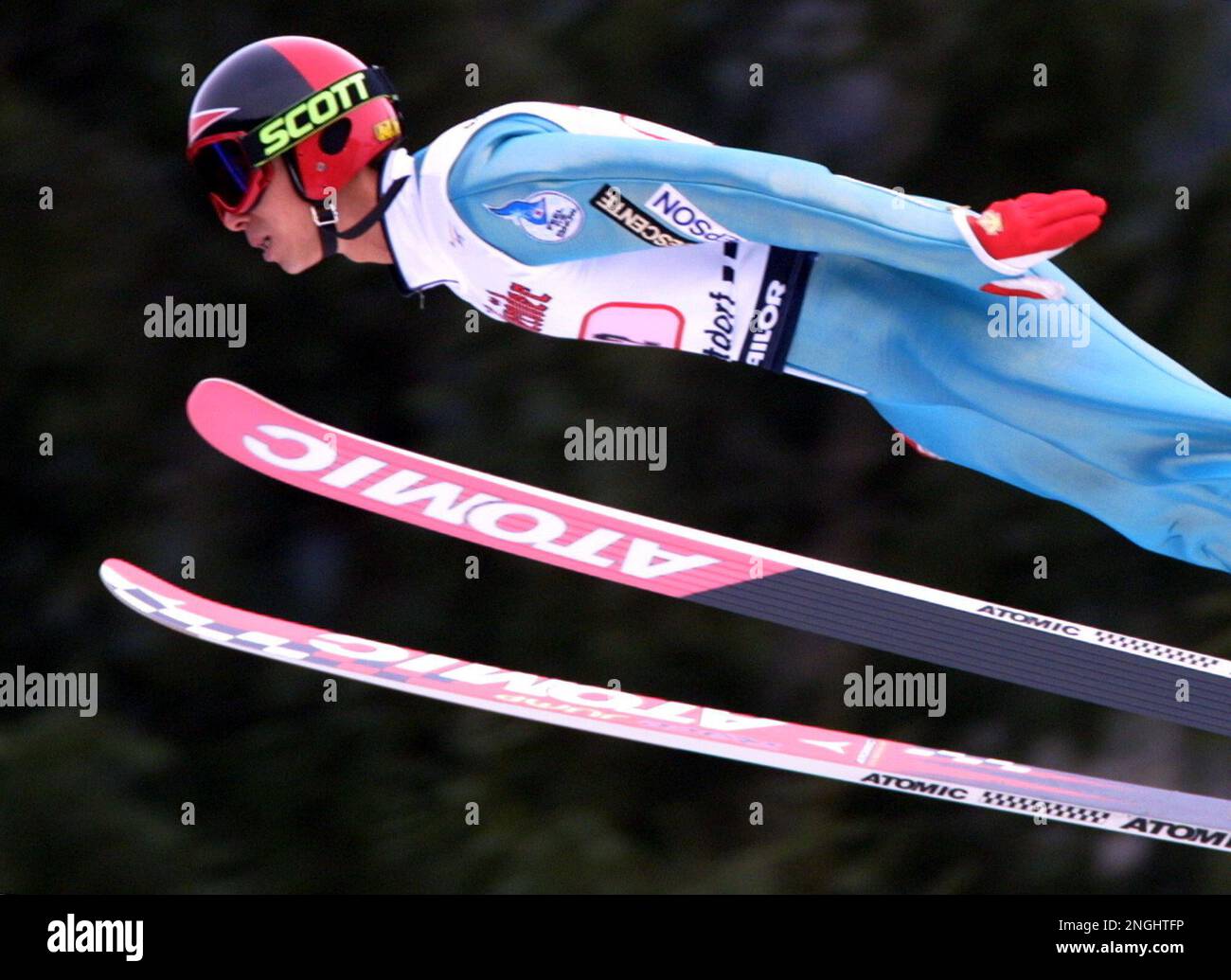 Masahiko Harada of Japan soars through the air during the first ...