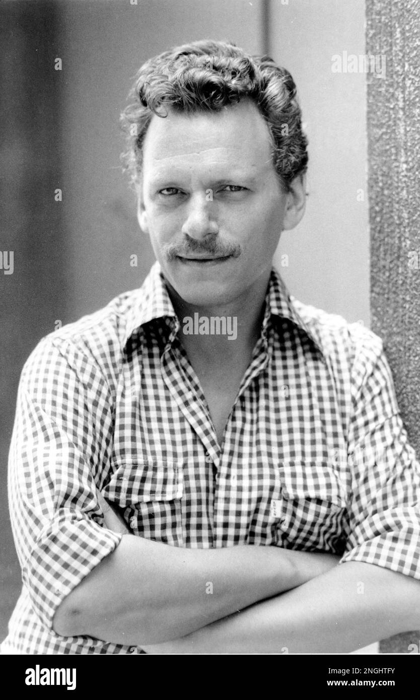 Playwright Mike Weller, who wrote the screenplay for "Hair," poses in ...