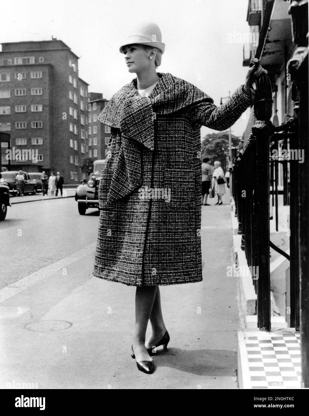A model poses in the Shannon coat designed by Charles Creed in London ...