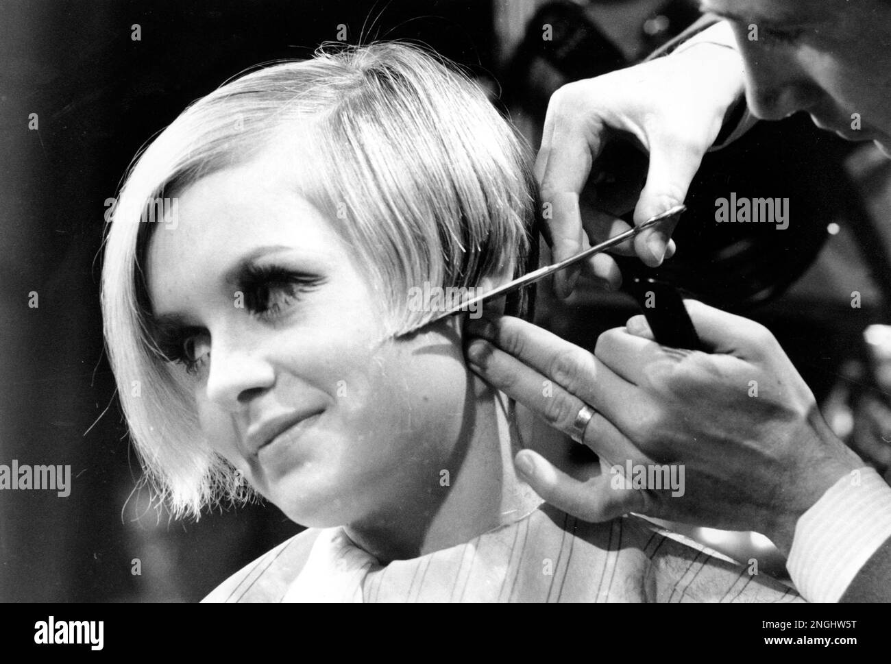 British fashion model Twiggy, known for her short hairstyle, has her hair trimmed in the ABC ...