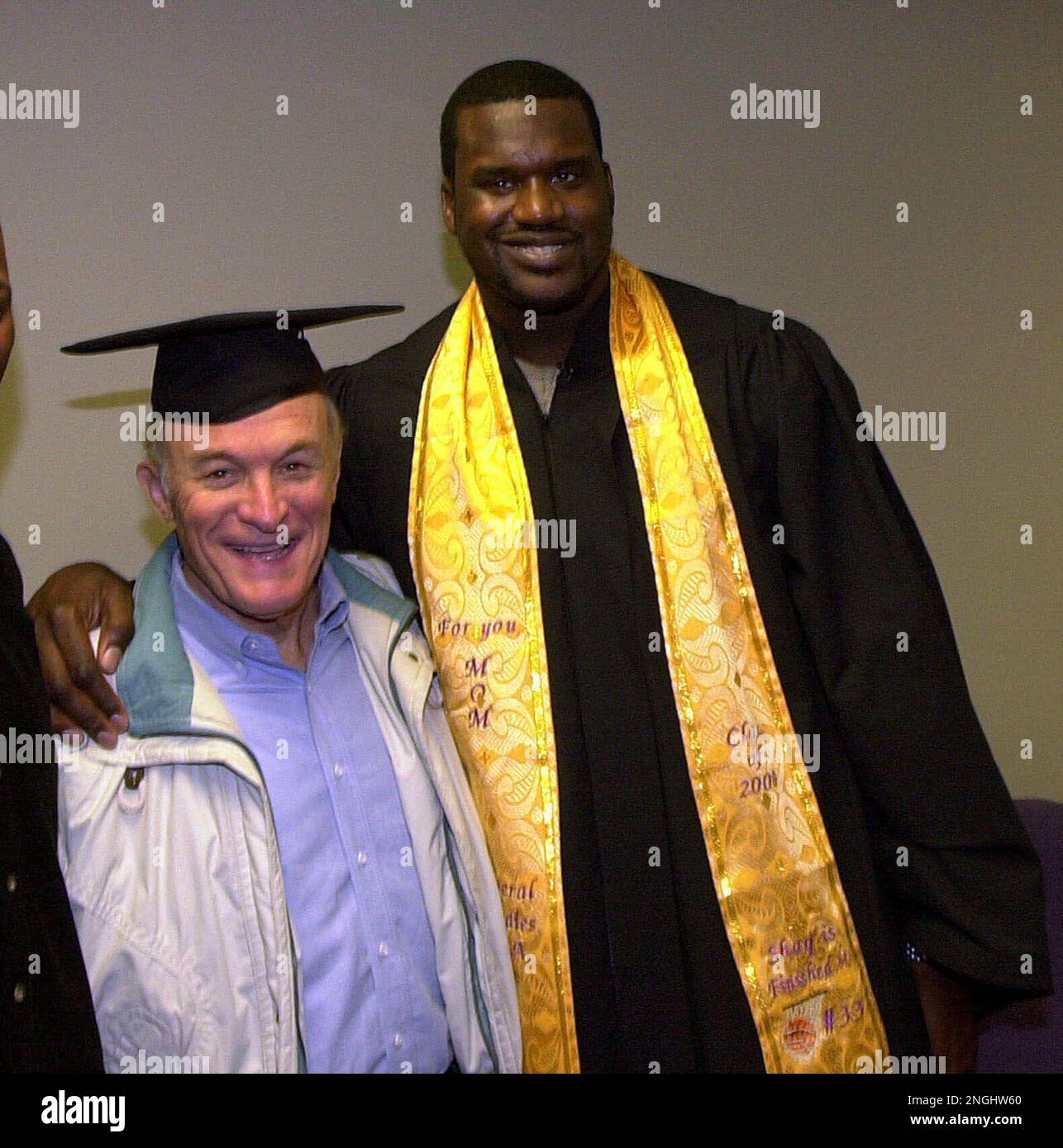 NBA star Shaquille O'Neal poses with his former college coach Dale ...