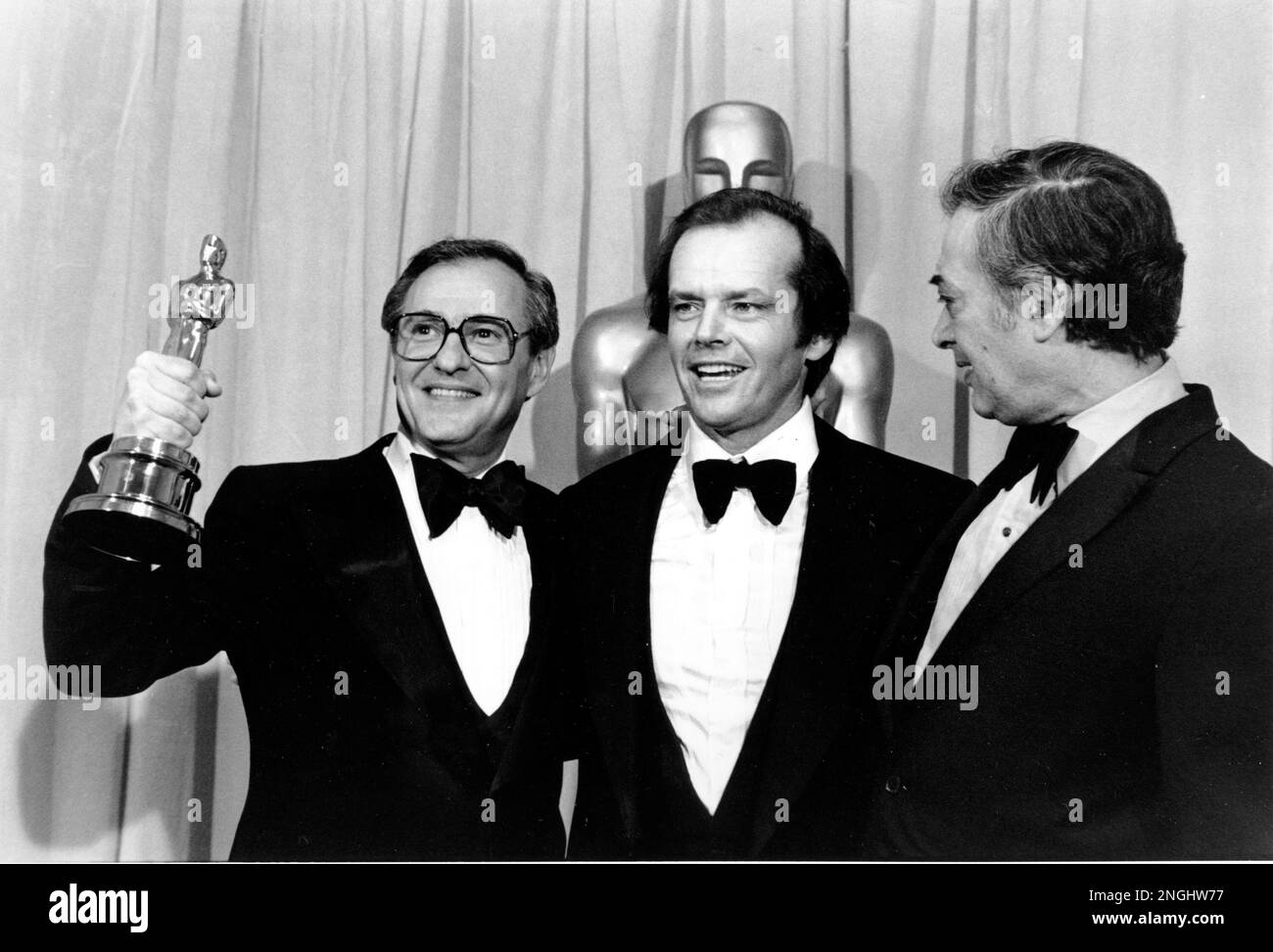 Producer Charles Joffe, holding the Oscar, actor Jack Nicholson, center ...