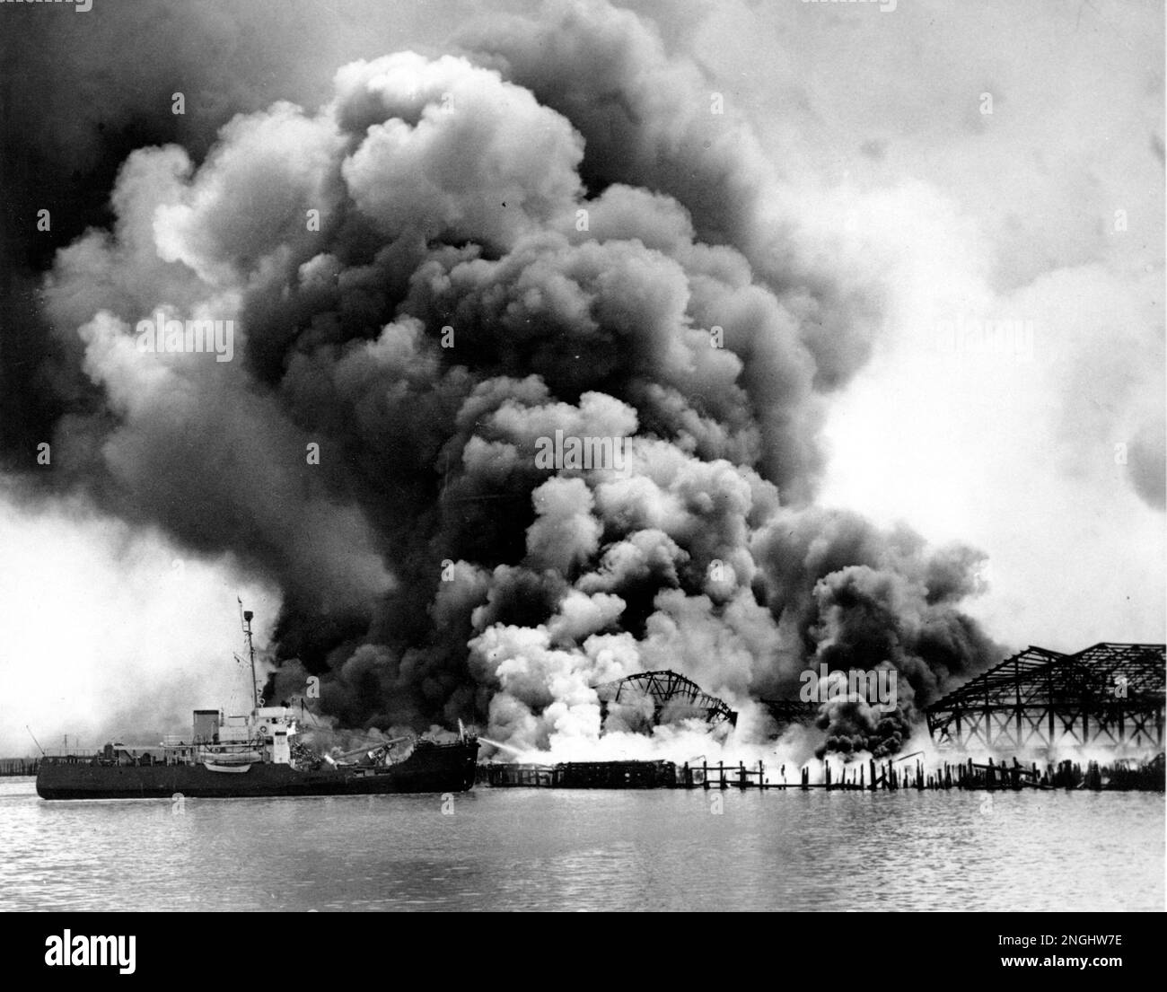 U.S. Coast Guard cutter Iris assists in fighting fire at the Monsanto ...