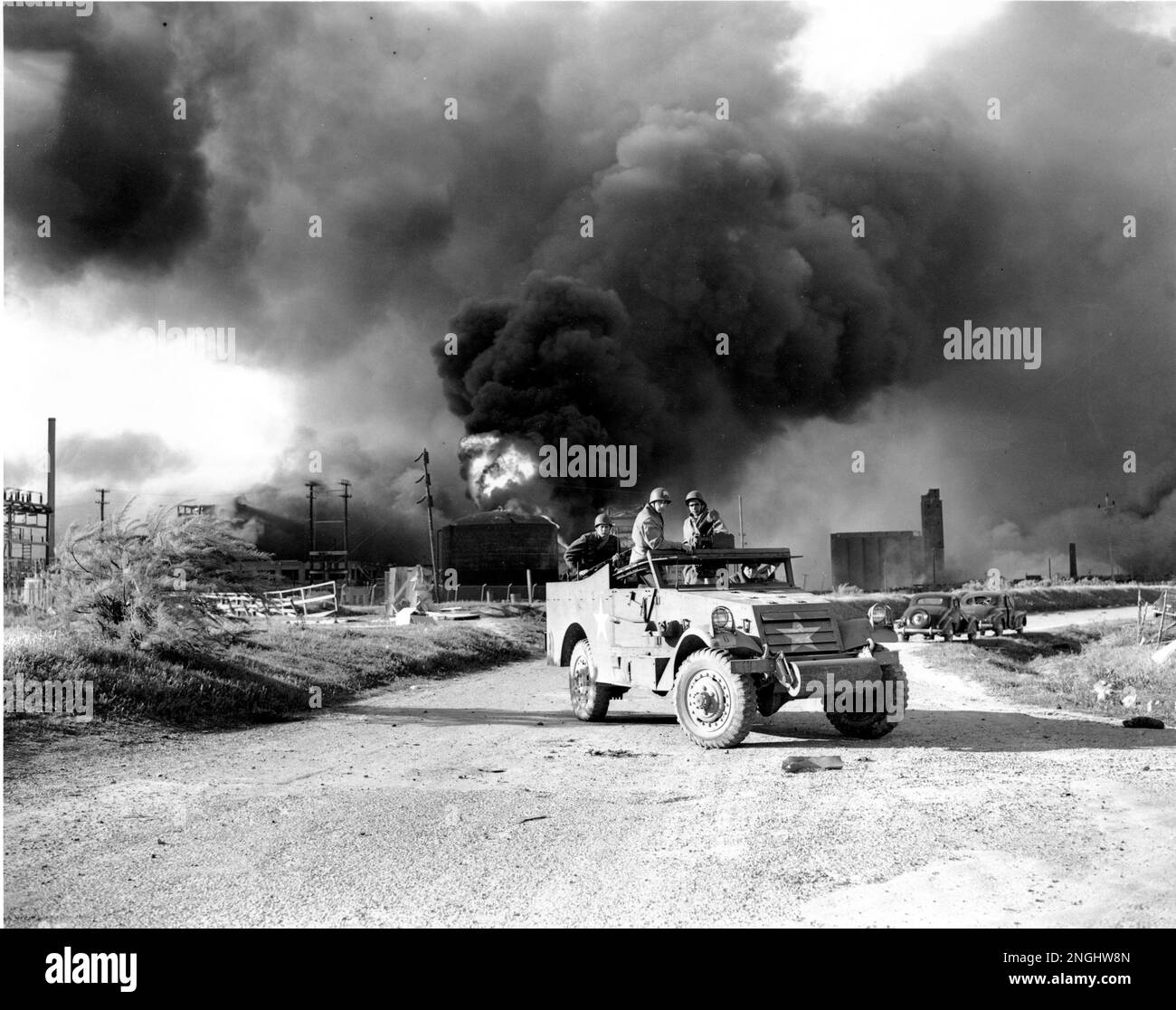 Armed U.S. troops in an armored truck form a road block at the Monsanto ...