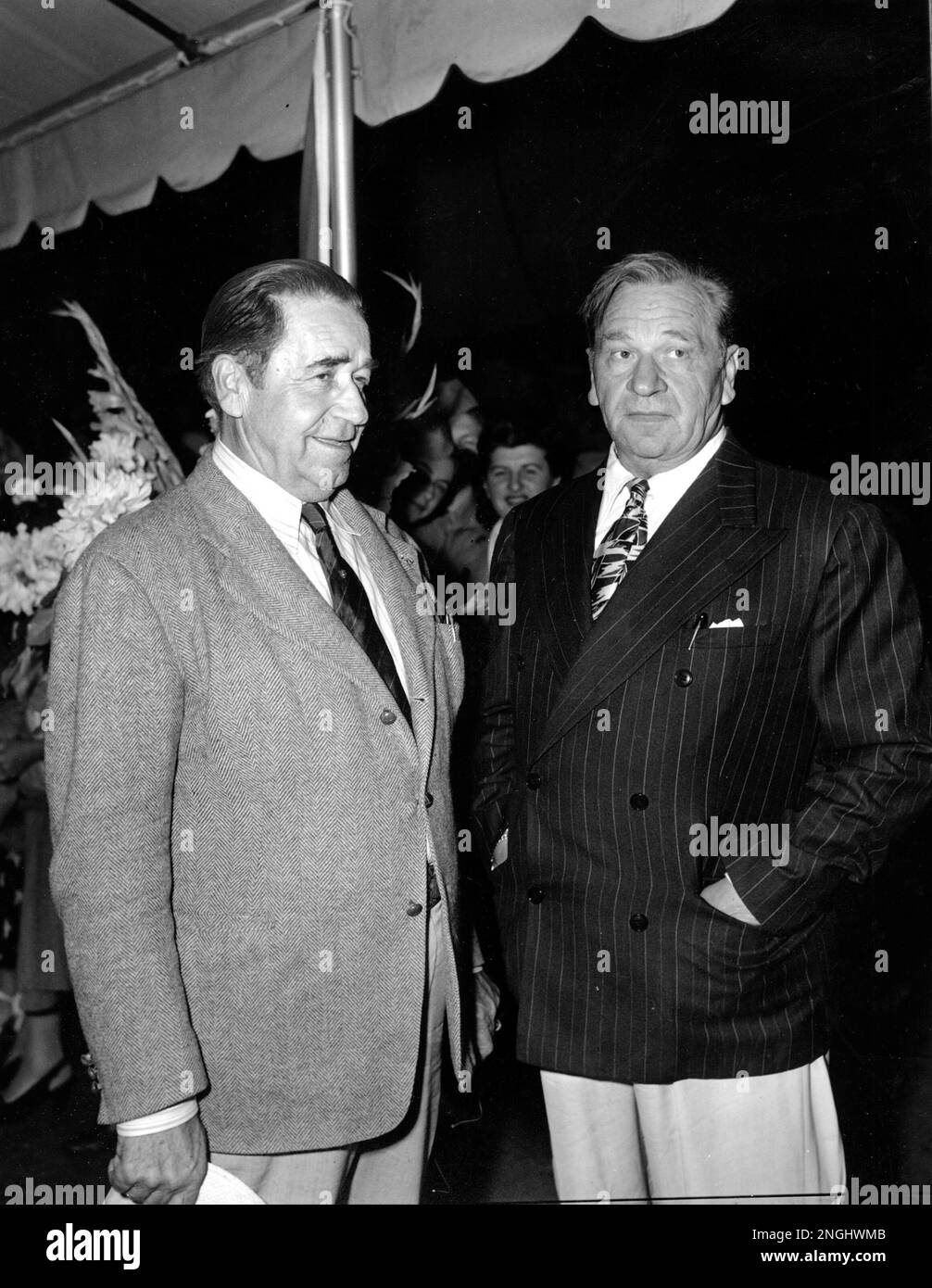 Actors Noah Beery Sr., and Wallace Beery stand together at the premiere of "Dragon Seed" at the ...
