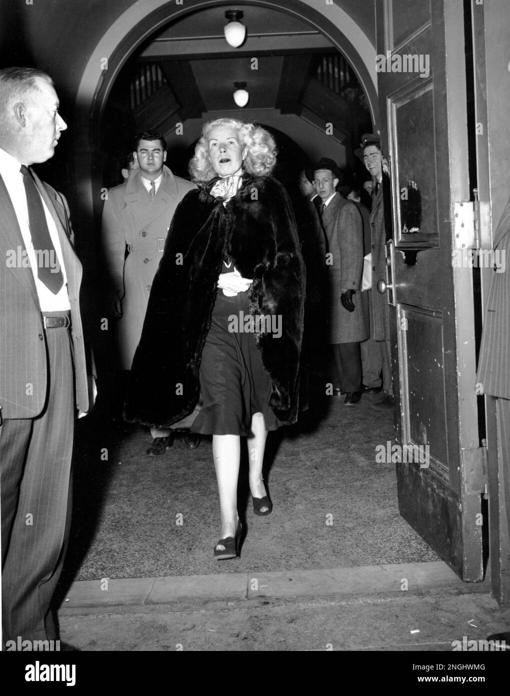 Mildred Gillars walks toward a jail van waiting outside the U.S ...