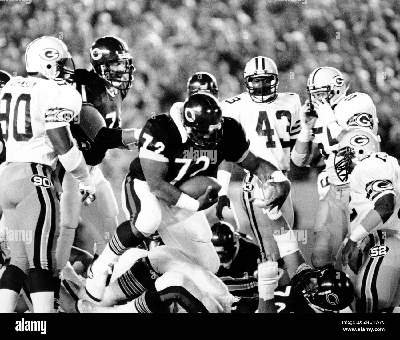 Chicago Bears' William "Refrigerator" Perry (72) helps an unidentified ...