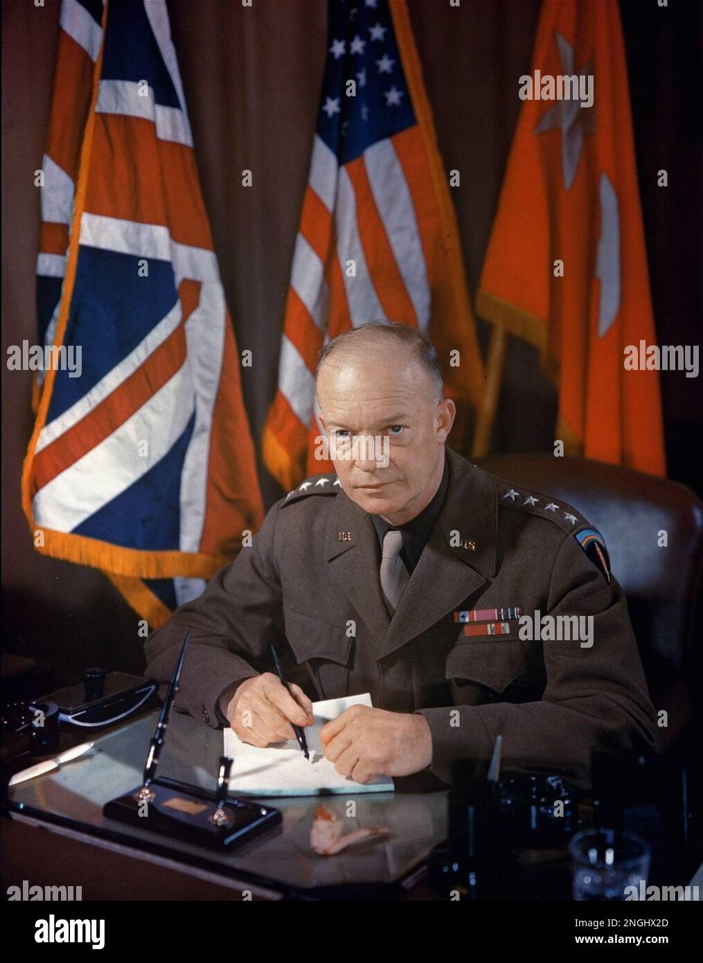This is a 1945 photo of General Dwight D. Eisenhower seated behind his ...