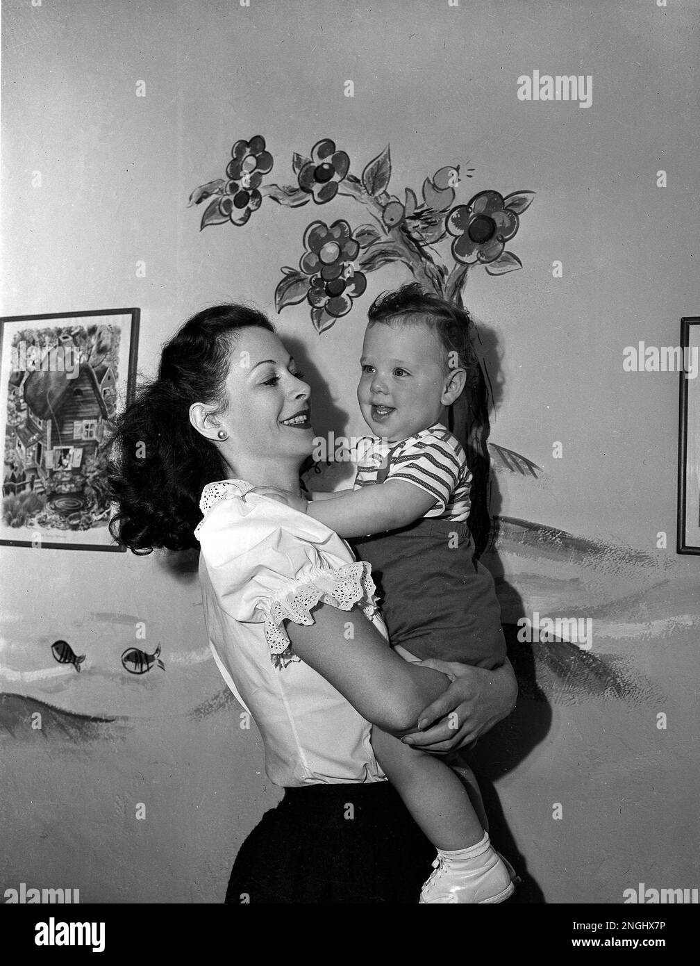 Actress Hedy Lamarr holds her youngest son, Anthony John, in her arms ...