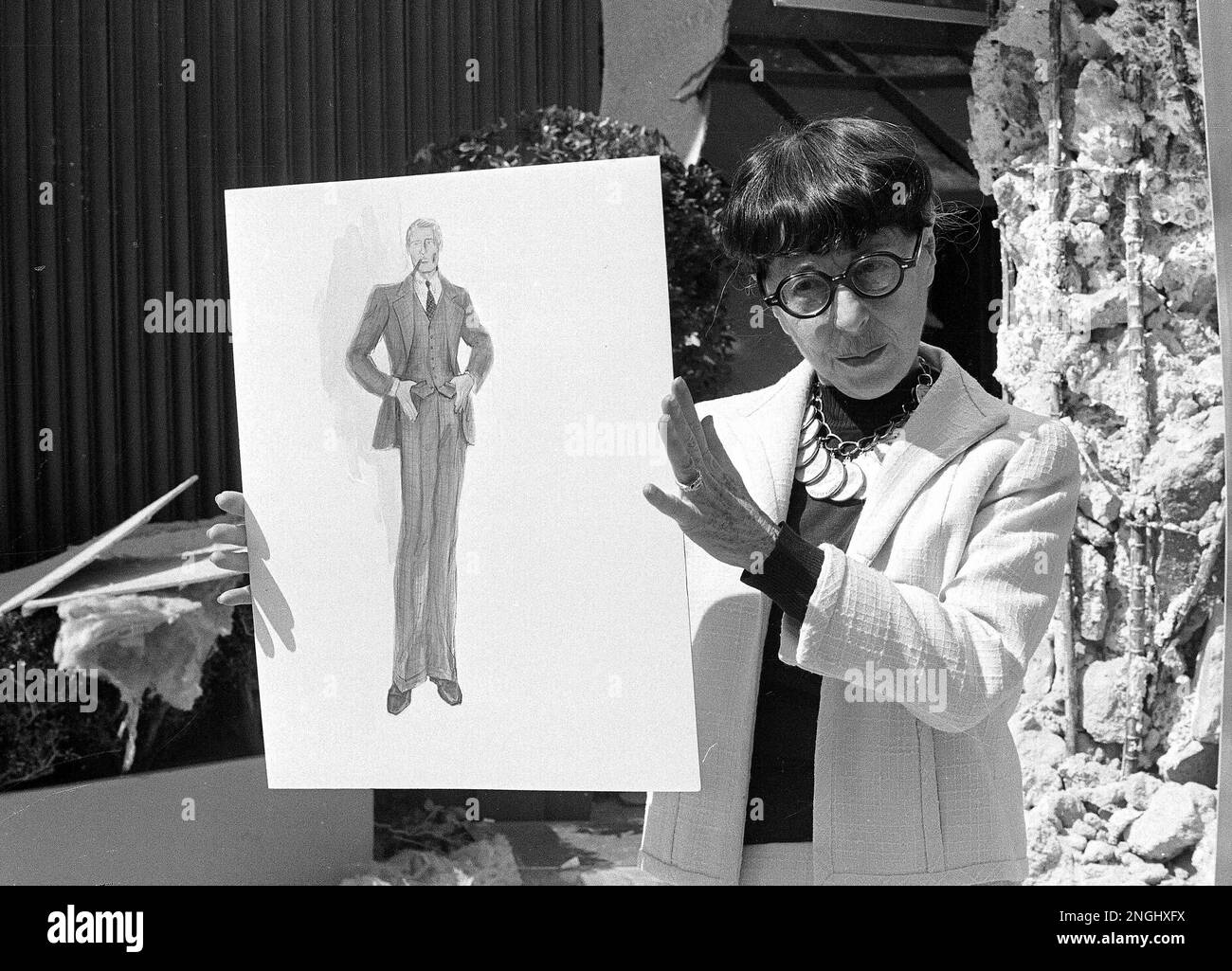 Costume designer Edith Head displays one of her designs in Hollywood in ...