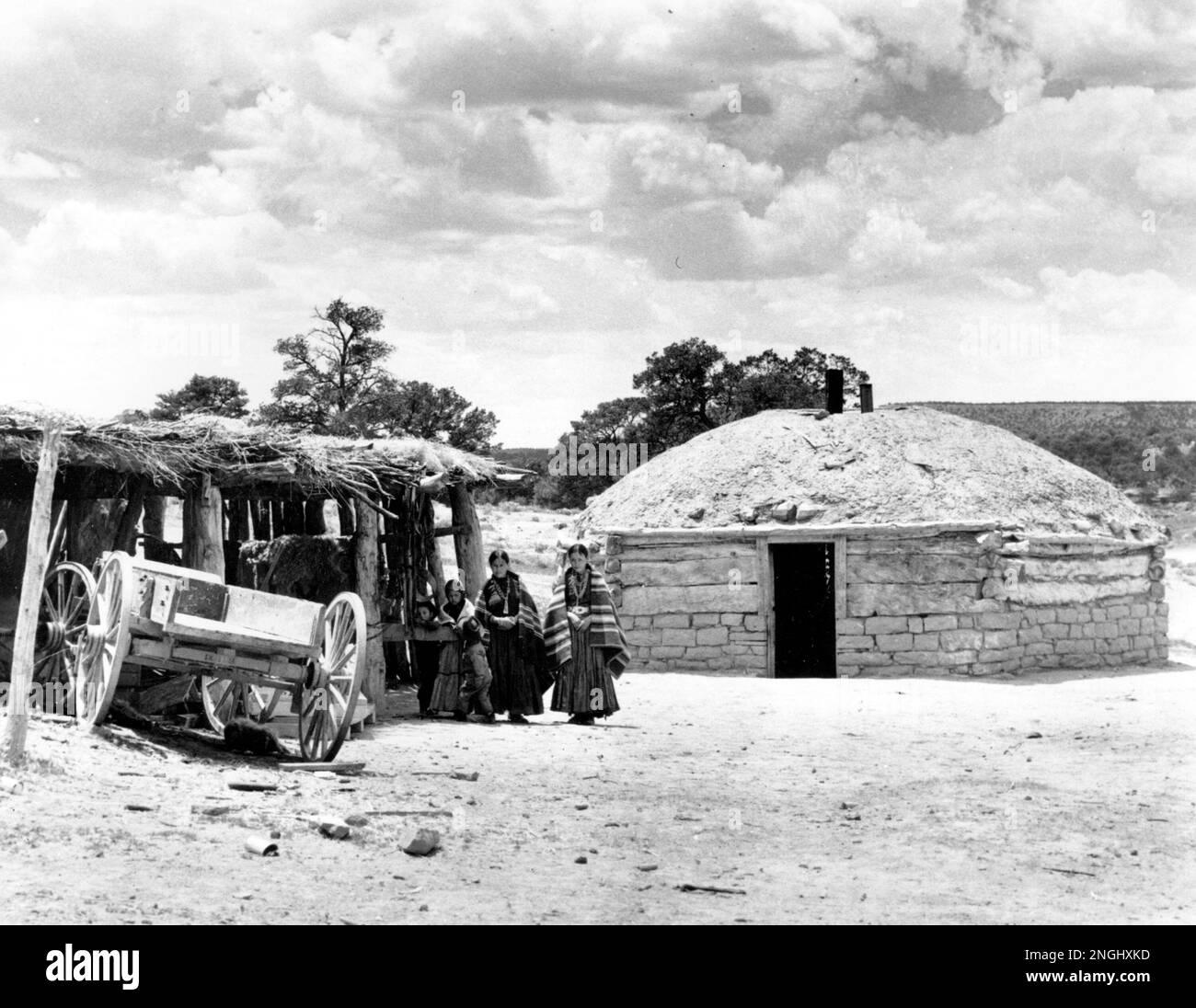 Native American women and girls pose by their home on the Northern ...