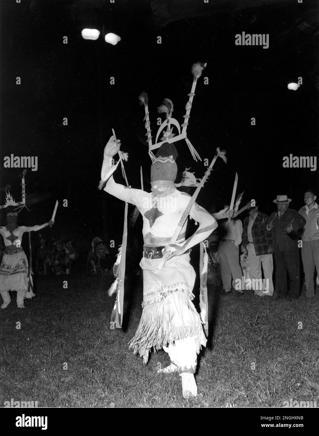 A masked member of the Apache Indian tribe performs the Devil Dance for ...