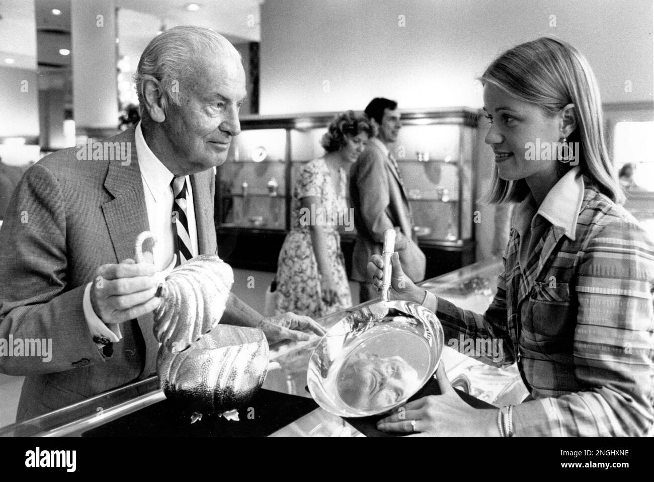 Walter Hoving, Board Chairman of Tiffany & Co., makes one of his twice ...