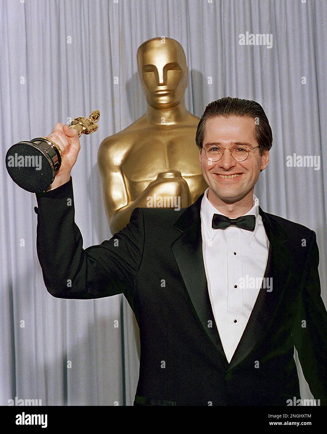 John Patrick Shanley holds his Oscar statuette at the 60th Academy ...
