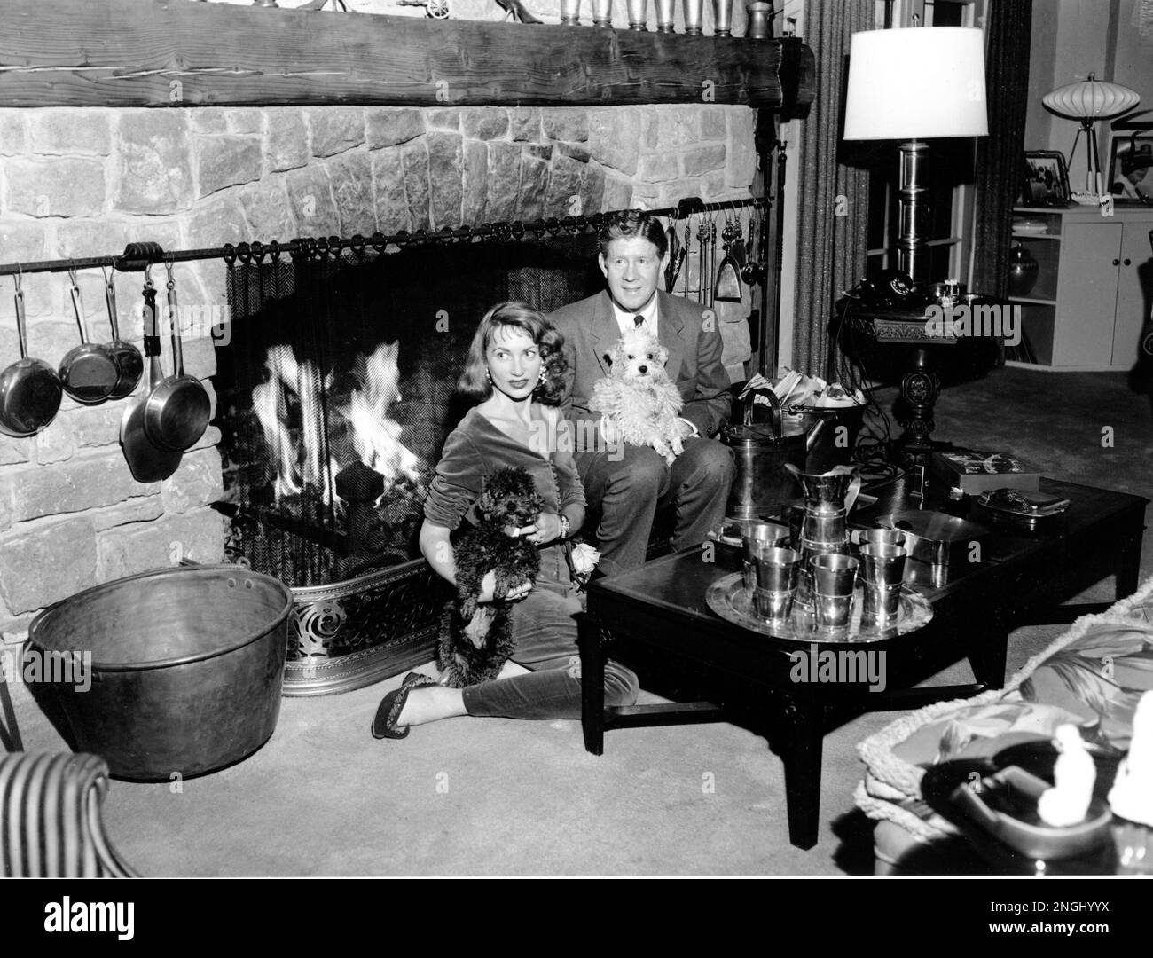 Singer Rudy Vallee poses with his wife, Eleanor, and dogs in his living ...