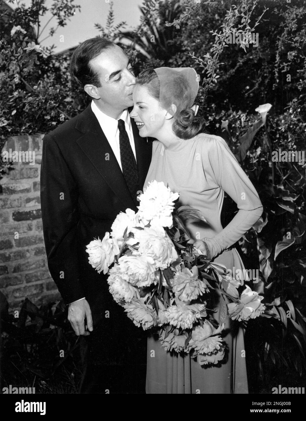 Movie director Vincente Minnelli places a kiss on the brow of actress ...